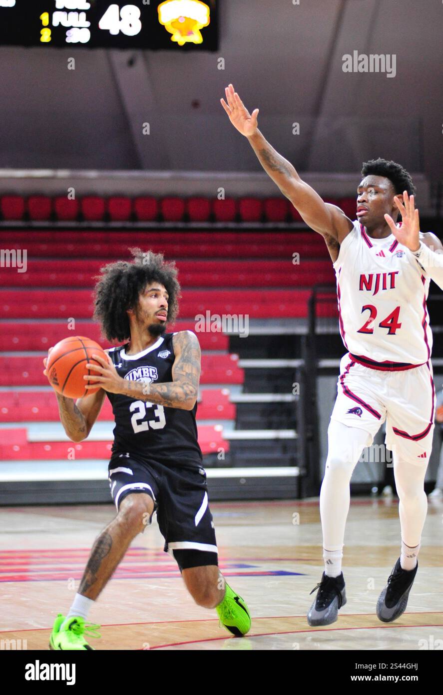 Newark, USA. 09th Jan, 2025. UMBC's Bryce Johnson (43) and NJIT's Ari Fulton (6) during the ...