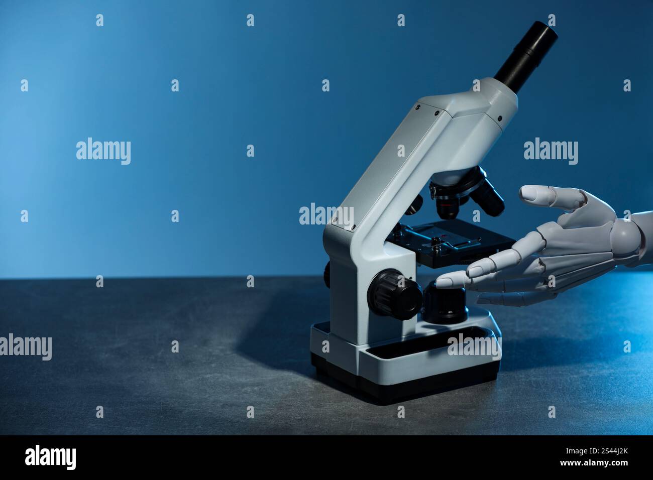 Artificial intelligence. Robot hand working with microscope at grey ...