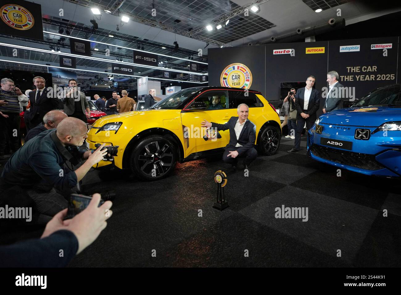 Renault brand CEO Fabrice Cambolive, center, poses with the trophy in ...