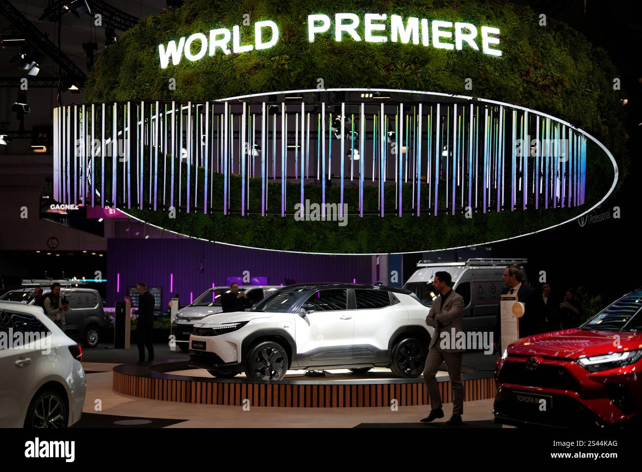 A man walks by as Toyota's fully electric SUV Urban Cruiser makes it's ...