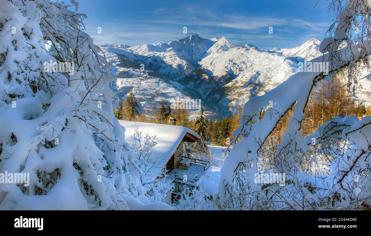 winter landscape in alpine french mountain covered with snow under blue ...