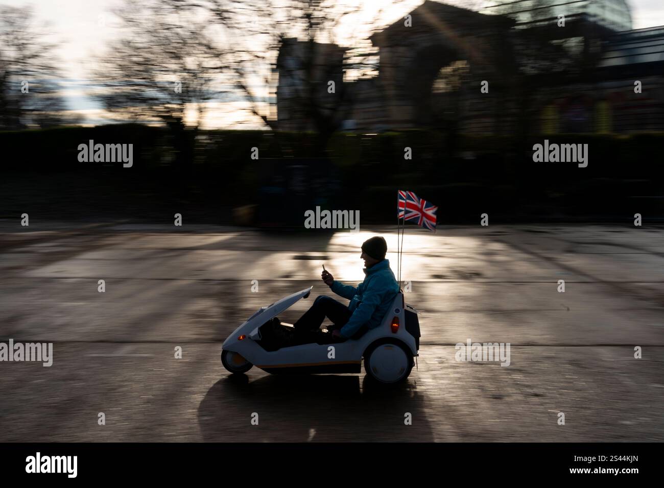 A journalist drives a C5 at a gathering of Sinclair C5 enthusiasts at ...