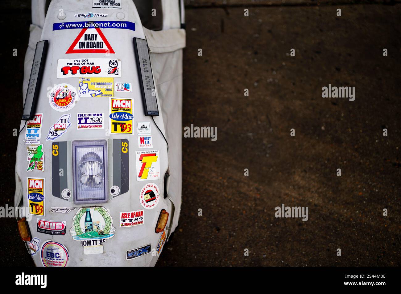 A Sinclair C5 decorated in stickers at a gathering at Alexandra Palace ...