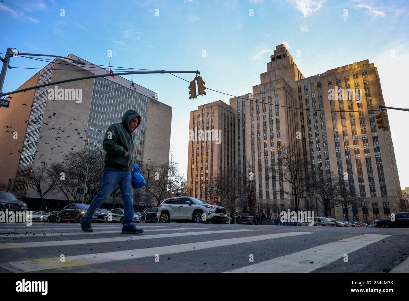 A man crosses the street outside Manhattan criminal court before the ...