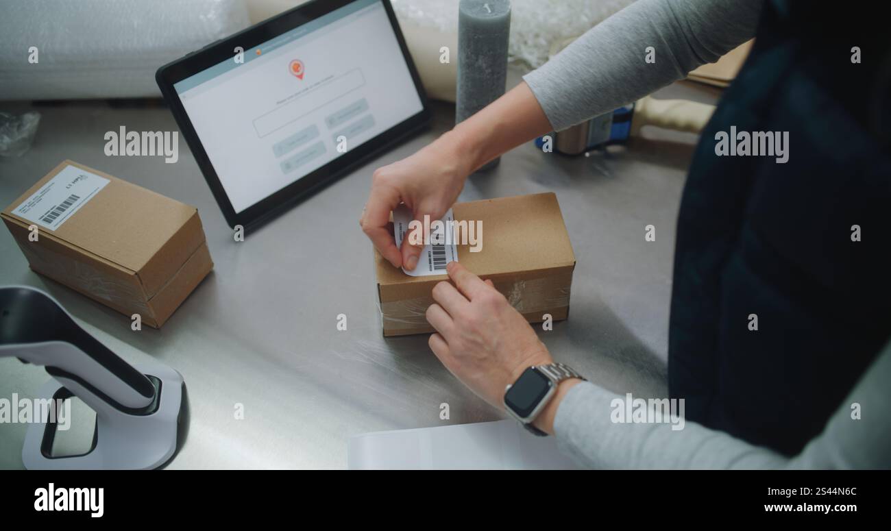 Close Up of Female Shipping and Receiving Clerk Packing Cardboard ...