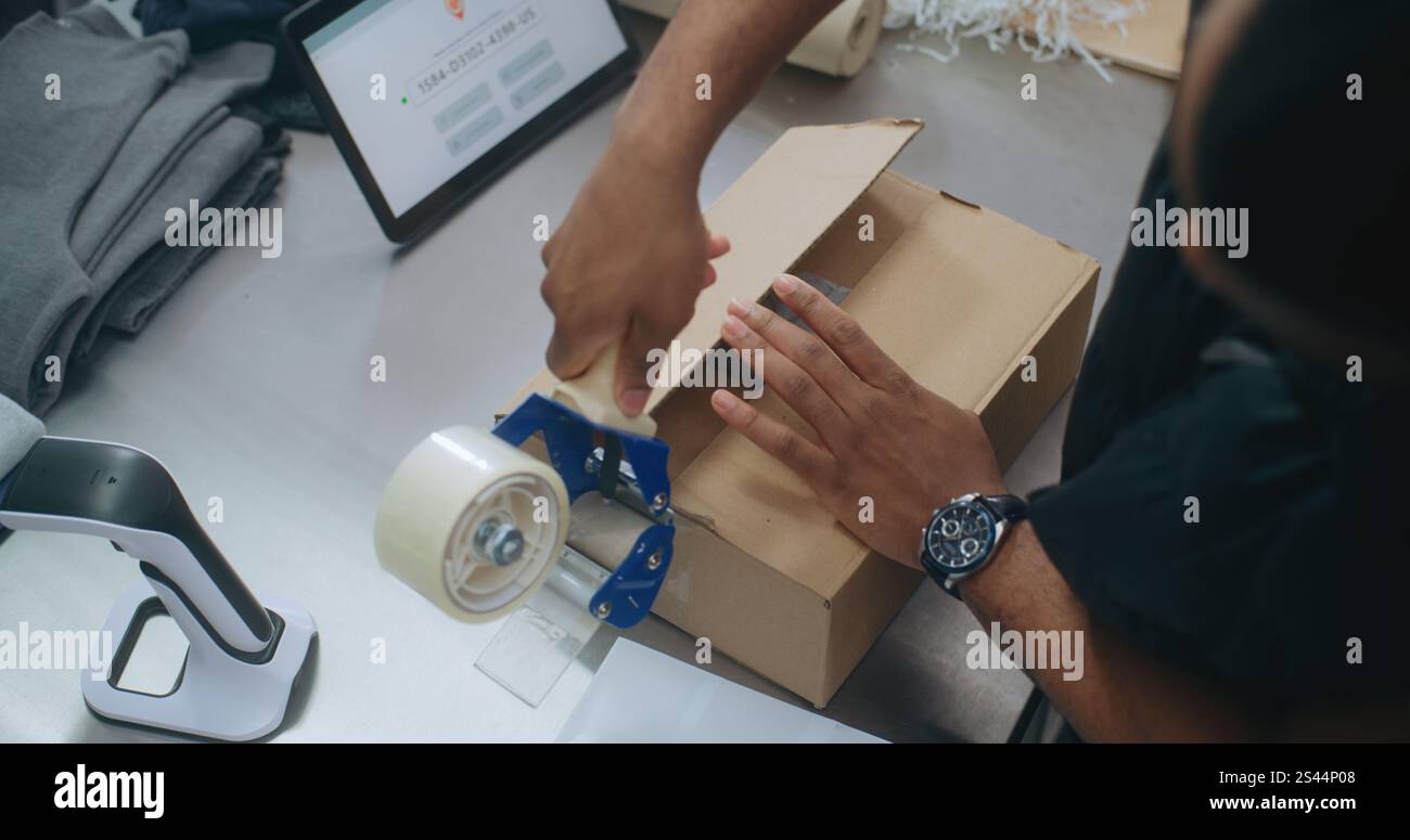 Top View on African American Shipping and Receiving Clerk Packing ...