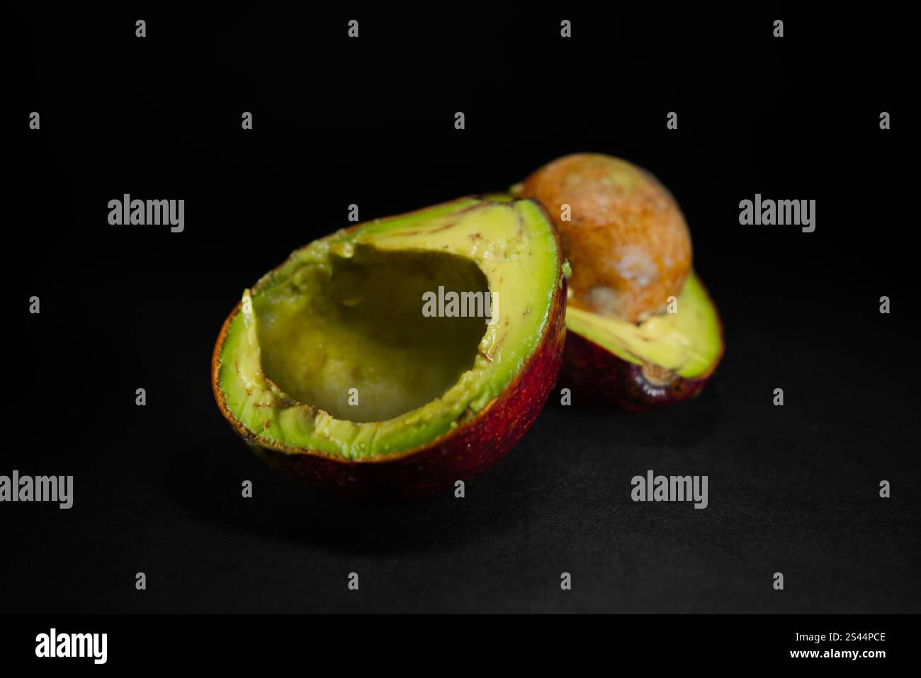 Split avocado is a fresh and healthy variant of avocado Stock Photo - Alamy