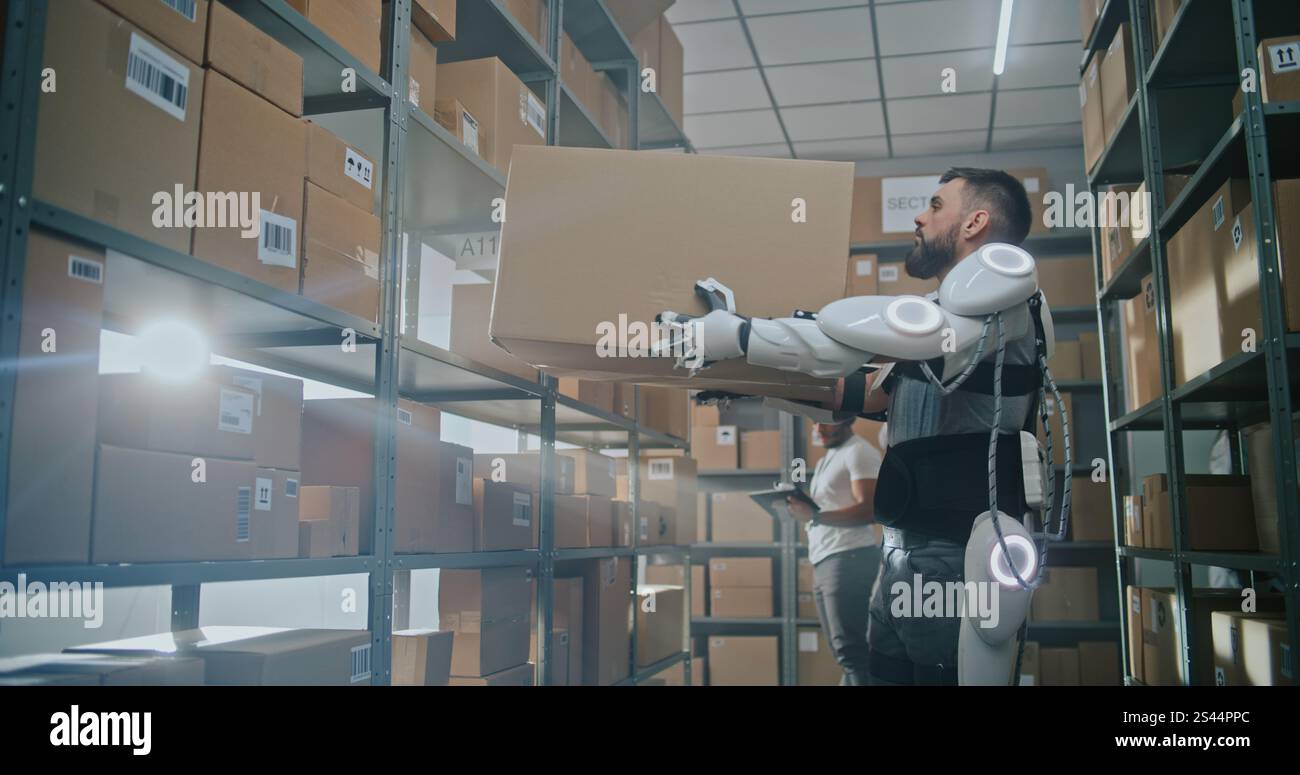 High-Tech Advanced Warehouse: Sorting Center Worker Wearing Futuristic Full Body Powered ...