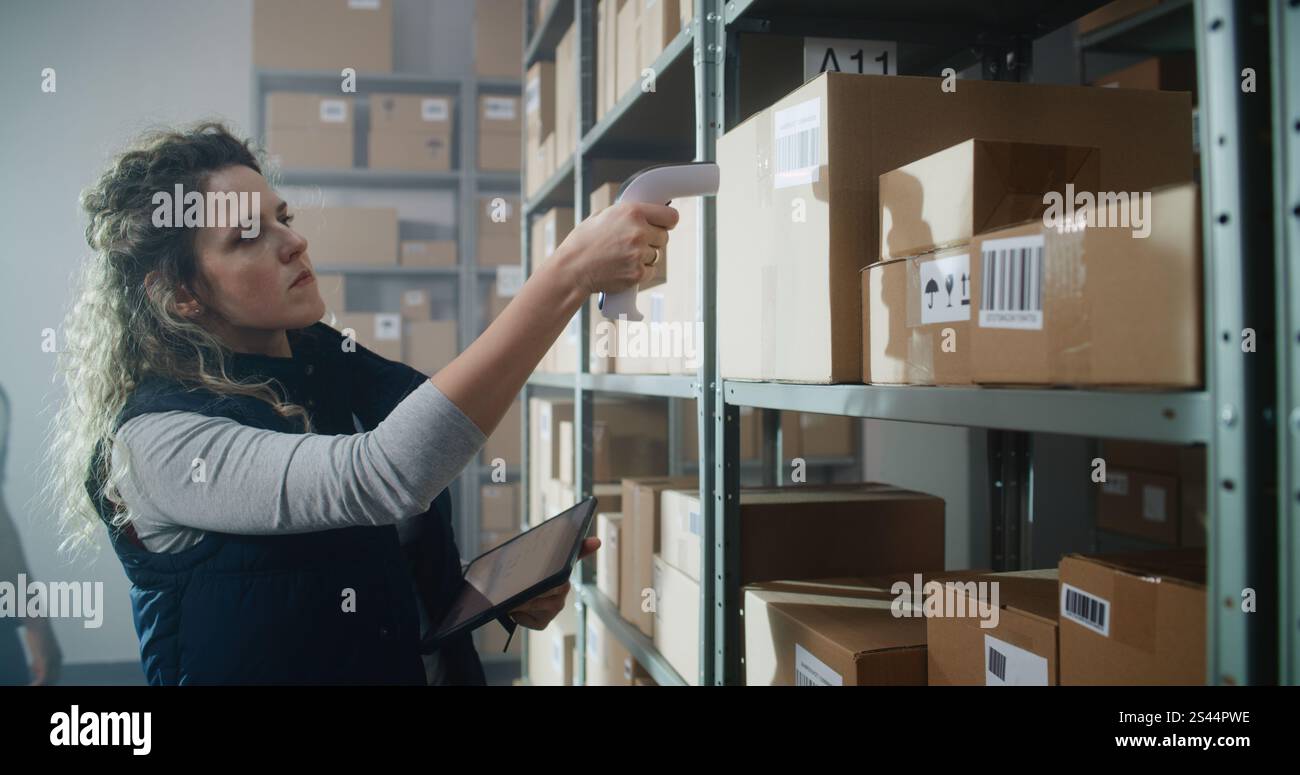 Female Warehouse Associate Scans Cardboard Box with E-Commerce Online Goods on Shelves with ...