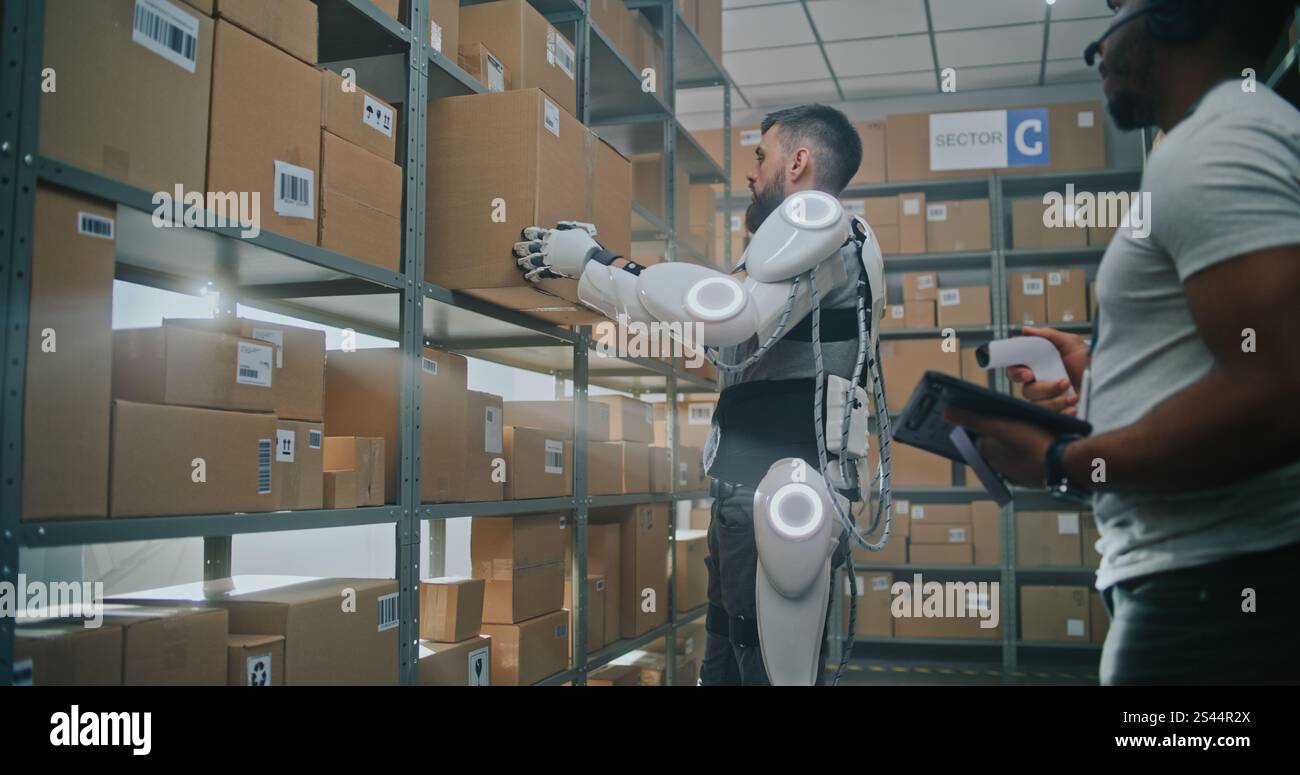 High-Tech Modern Warehouse: Worker Wearing Futuristic Full Body Robotic ...