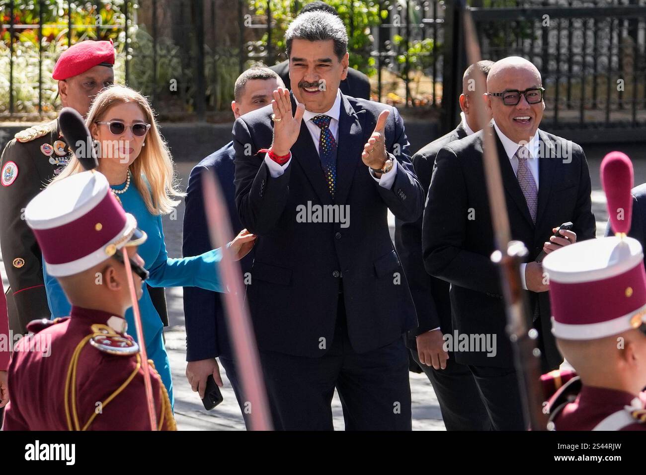 Venezuelan President Nicolas Maduro, his wife Cilia Flores, left, and ...