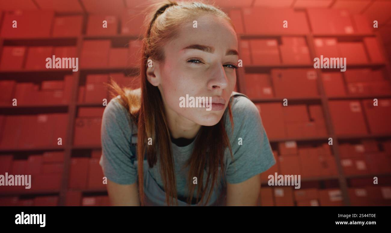 Portrait of Serious Female Warehouse Worker in Uniform Looking at ...