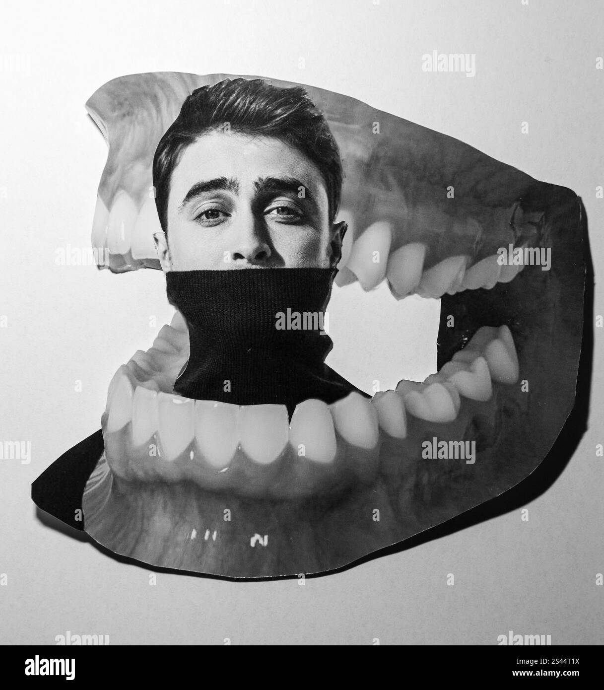 In this photo, you can see a man located within a jaw.His mouth is ...