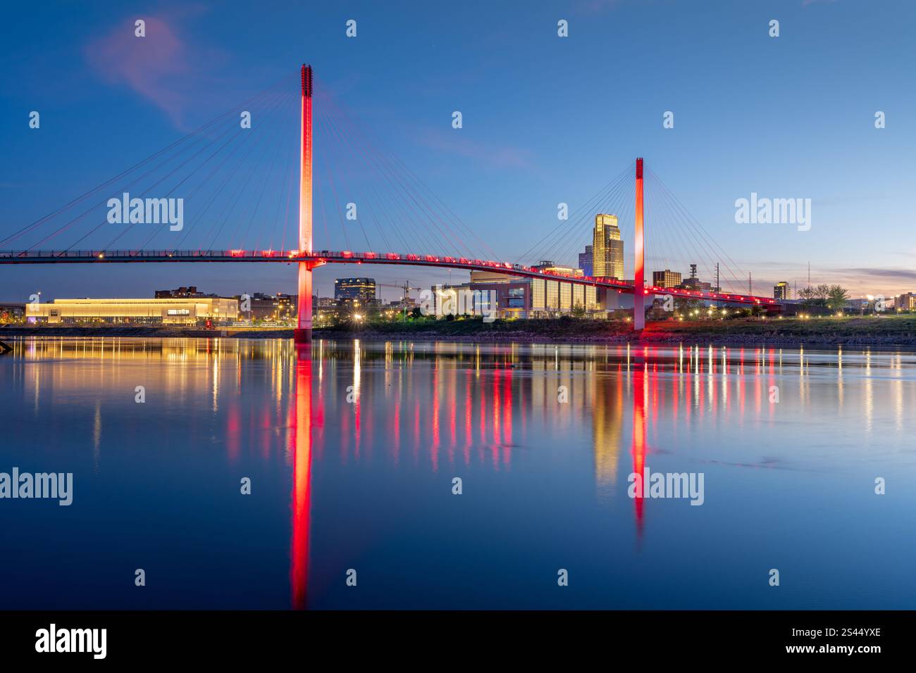 Omaha, Nebraska, USA downtown city skyline and pedestrian bridge at ...