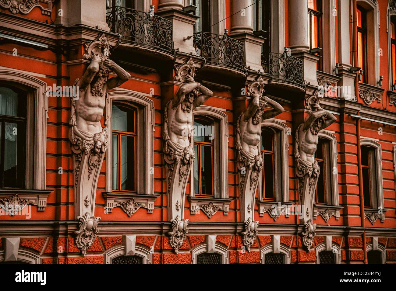 Bas-relief building male statues holding columns, exterior of classical ...