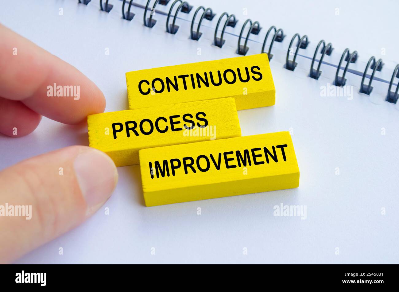 Continuous Process Improvement text on yellow wooden blocks Stock Photo ...
