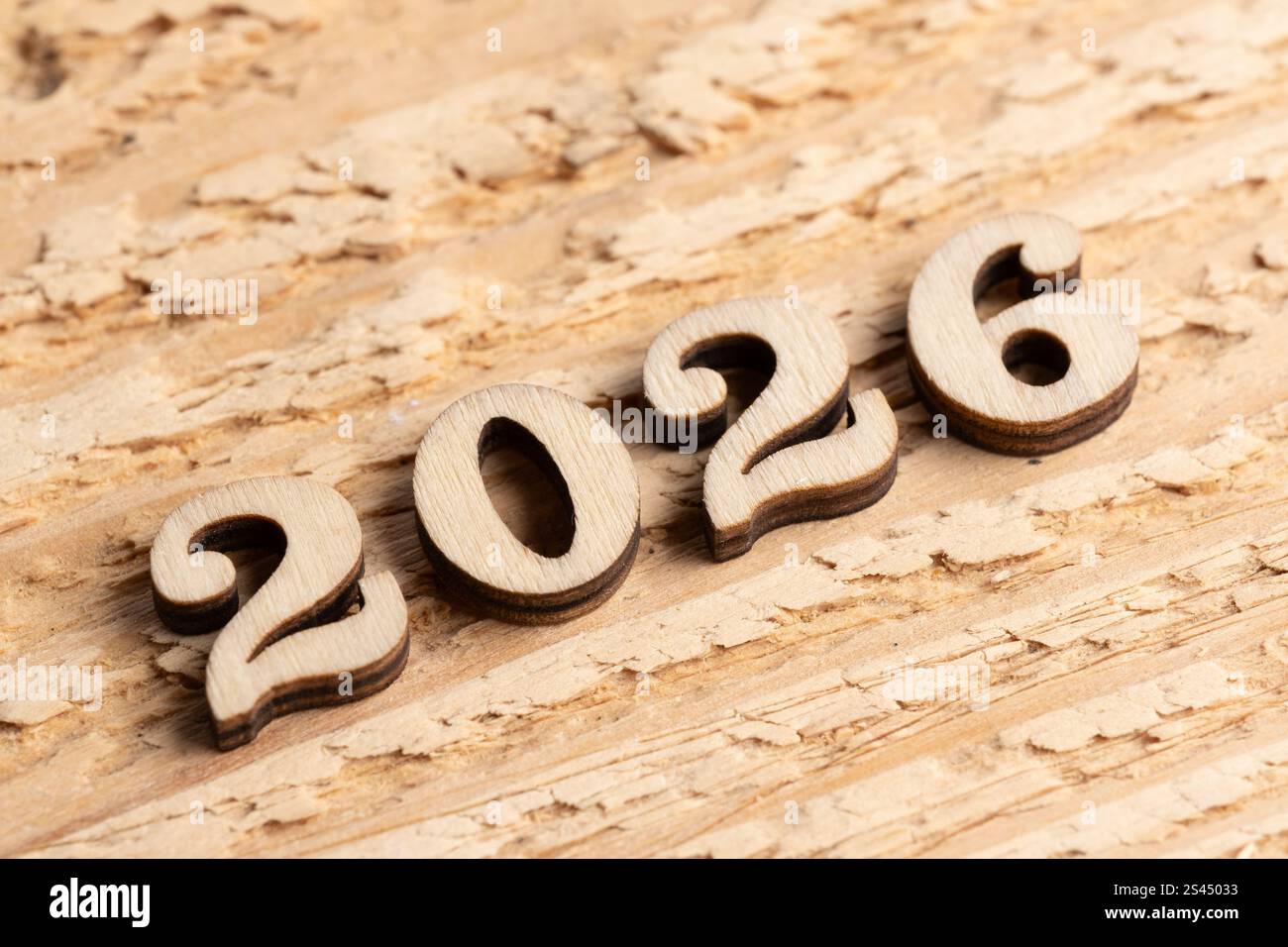 Wooden figures forming number 2026 on rustic wooden background Stock ...