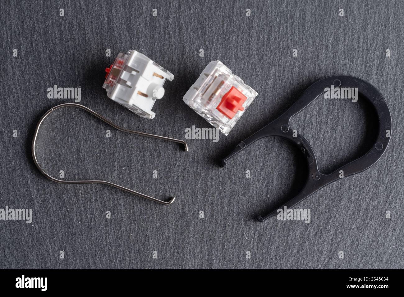 Components for mechanical keyboard on black background. View from above ...