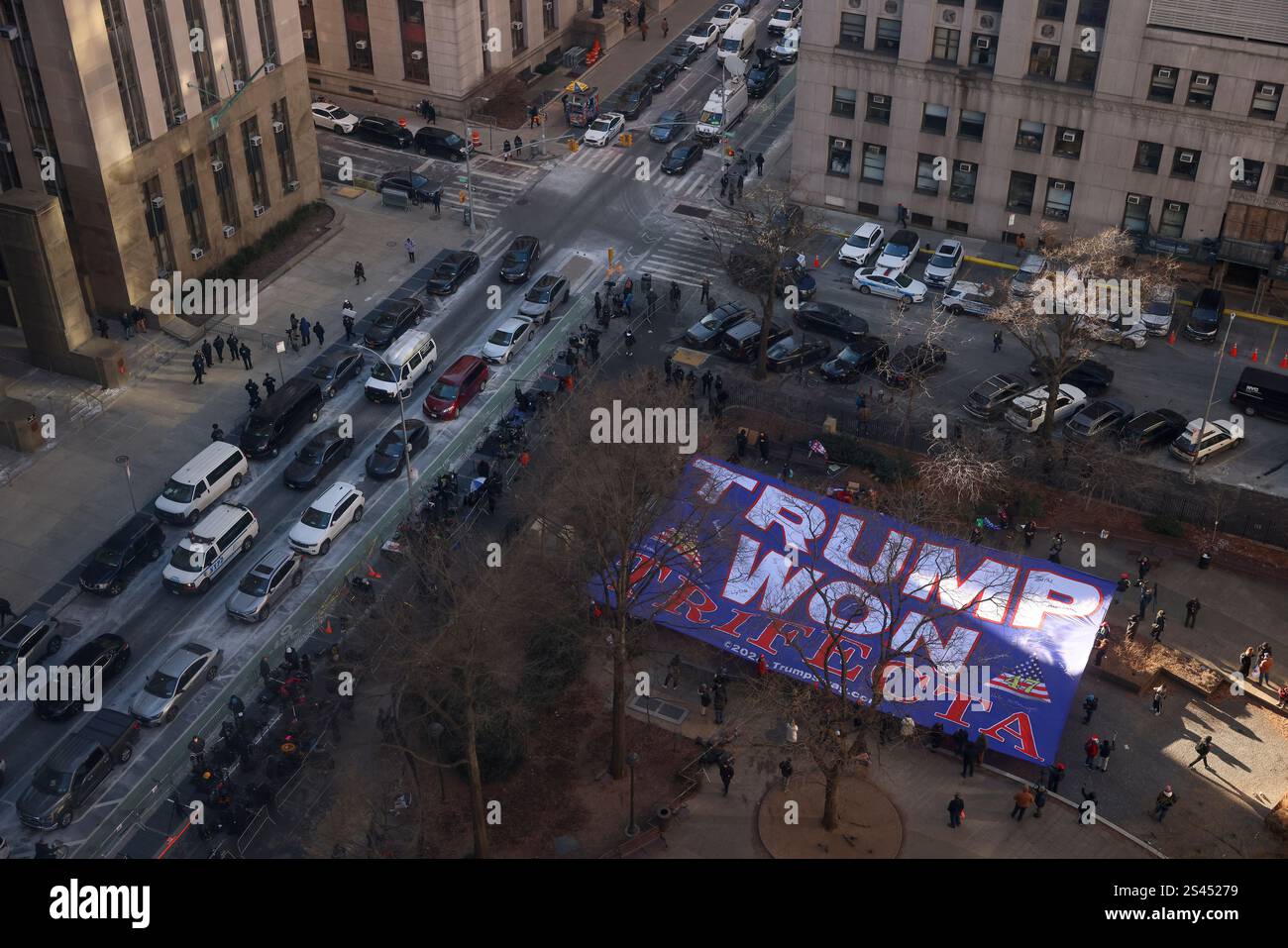 Supporters for President-elect Donald Trump display a banner outside ...
