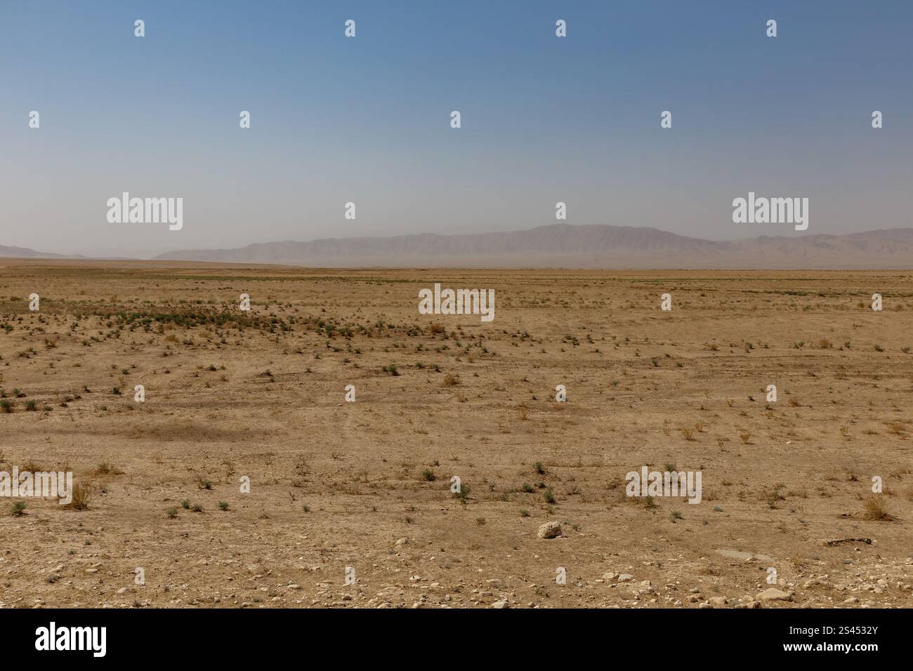 A dry, expansive landscape in Kunduz Province reveals a stark terrain ...