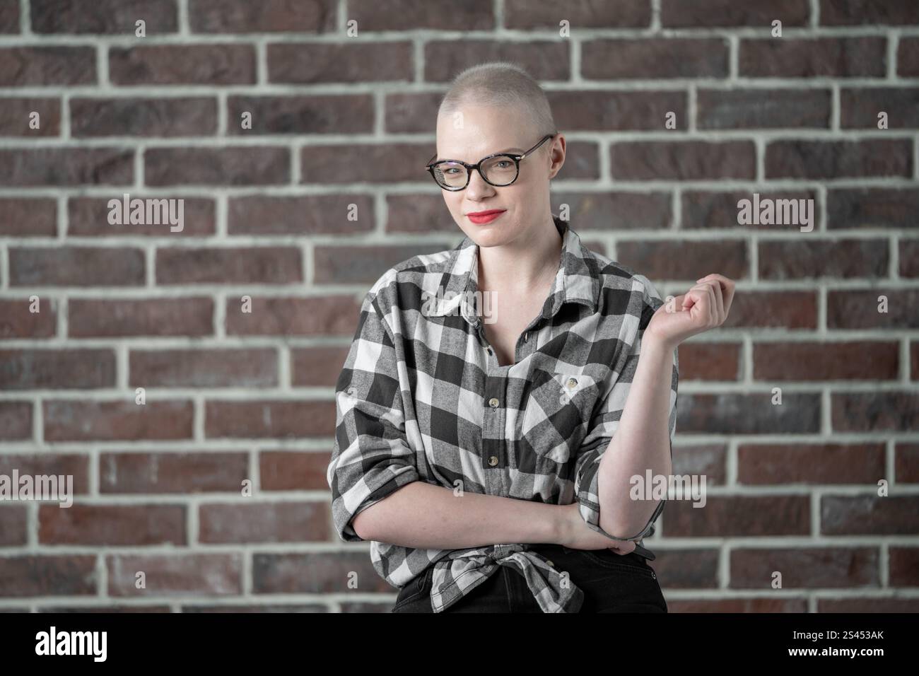 Portrait of a beautiful young caucasian woman with shaved head. Female ...