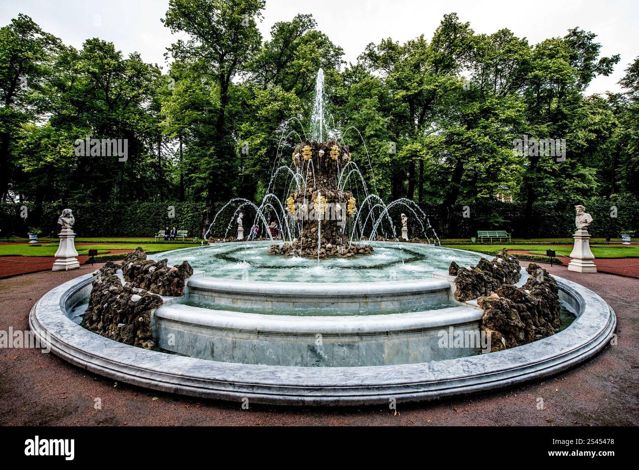 Beautiful classic cascading fountain in a green city park, recreation ...