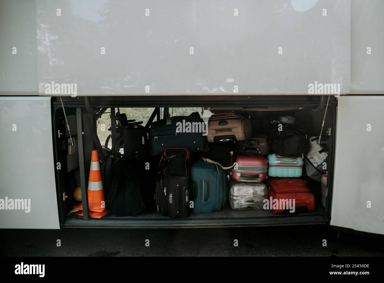 Suitcases of tourists loaded in the trunk of a bus, transport shuttle ...