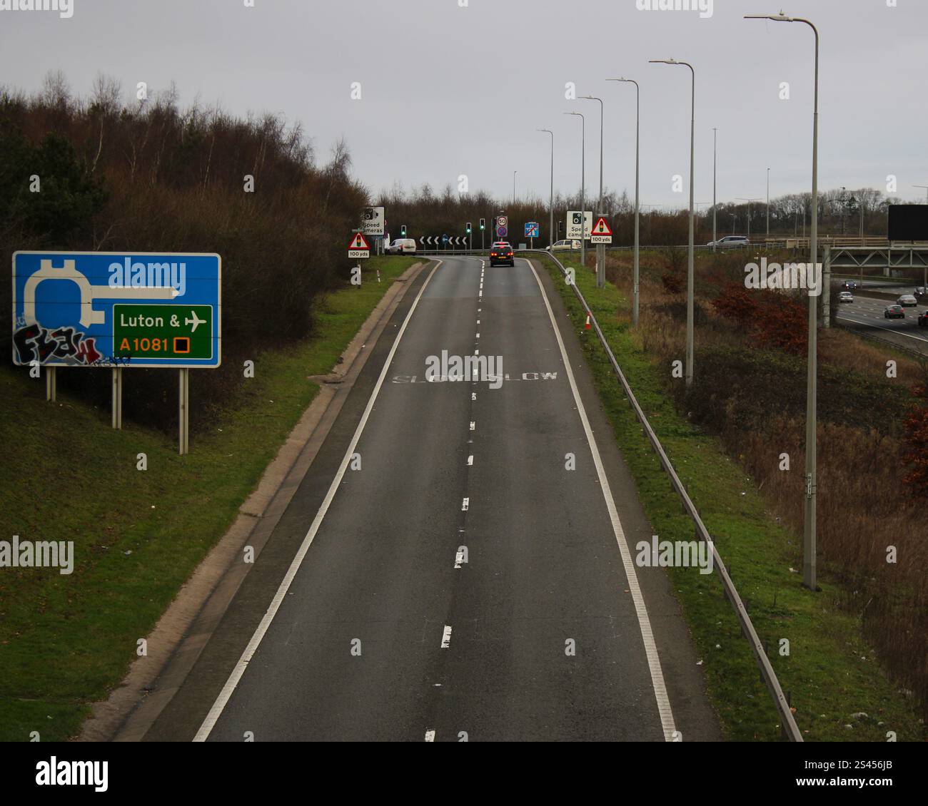 M1 Motorway offslip on a grey day heading towards London Luton Airport ...