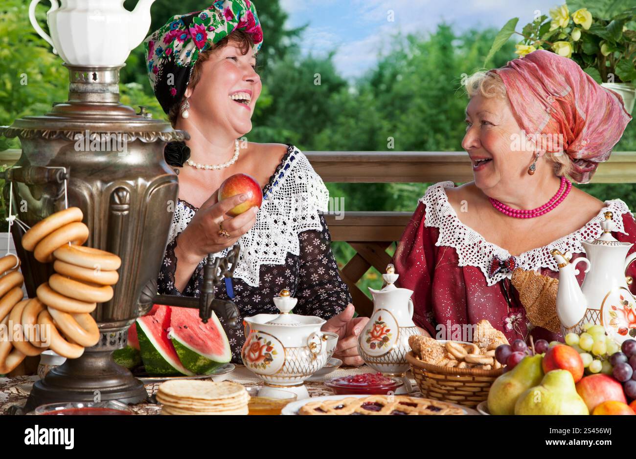 Mature women from the Victorian era carefree laugh while having a cup ...