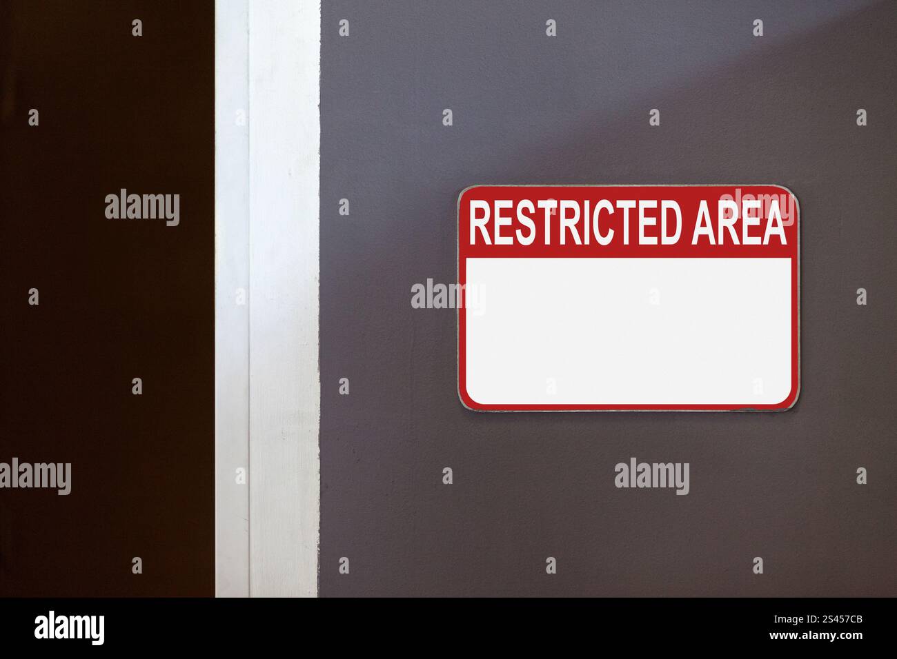 Red and white blank restricted area sign on the side of an open door ...