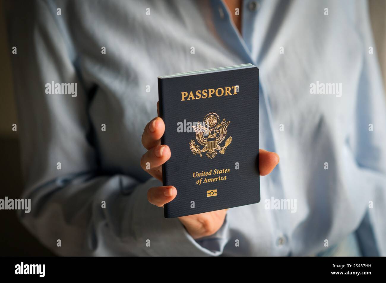 Anonymous female in full sleeves shirt while standing demonstrating ...