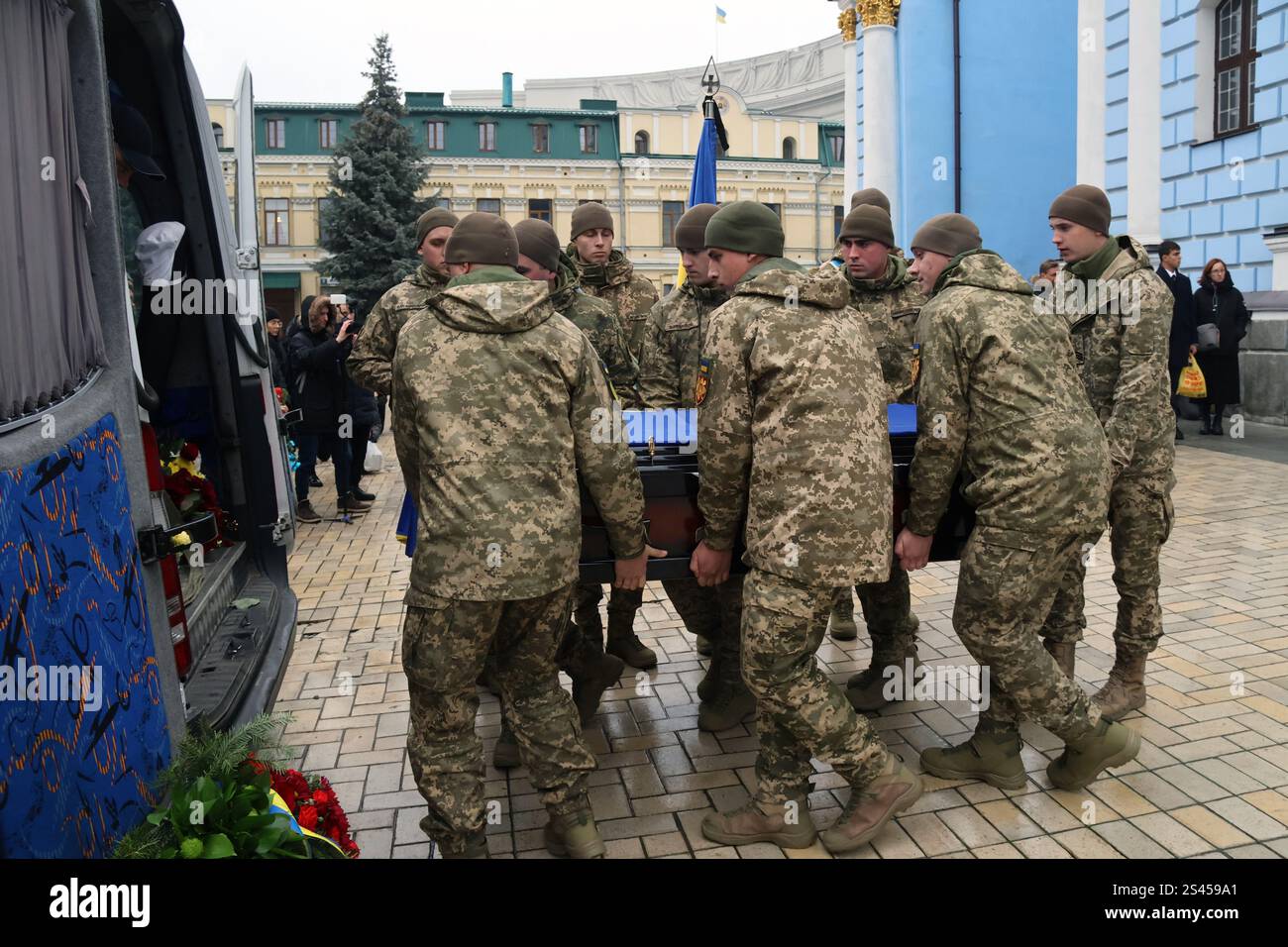 KYIV, UKRAINE - JANUARY 10, 2025 - Soldiers load the coffin with the body of the marine officer ...