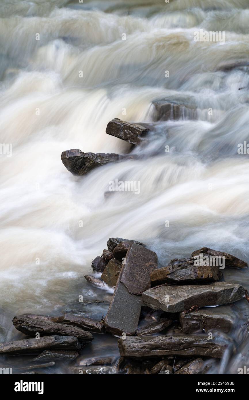 Water in motion with rocks in a stream after rain Stock Photo - Alamy