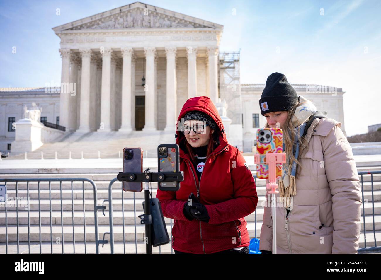 Tiffany Cianci and Sarah Baus speak to their TikTok Live feeds outside ...