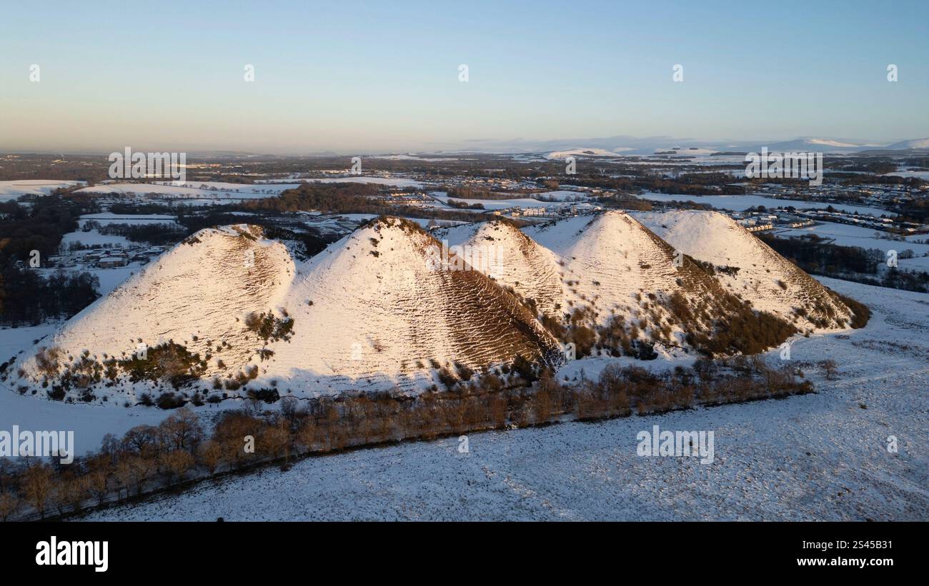 Aerial view of the Five Sisters shale bing after snowfall, West Calder ...