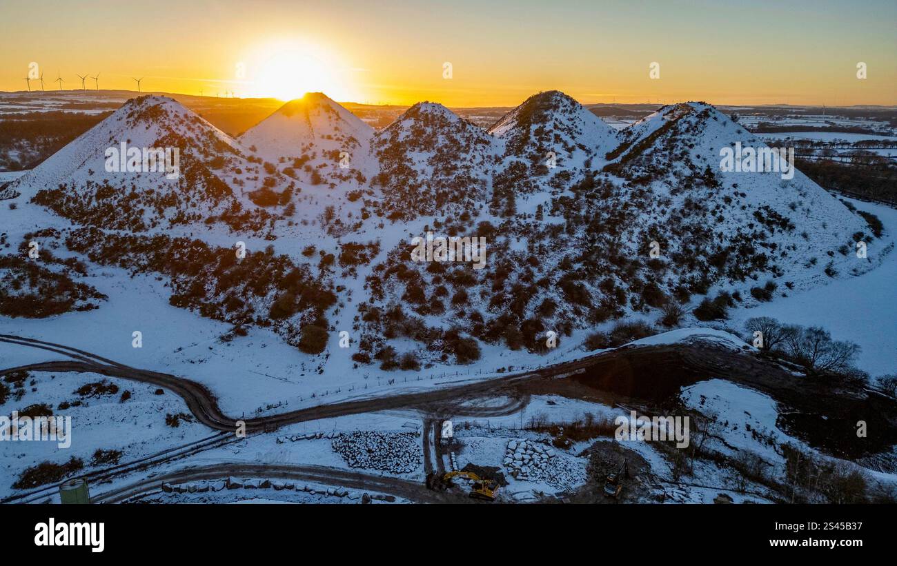 Aerial view of the Five Sisters shale bing after snowfall, West Calder ...