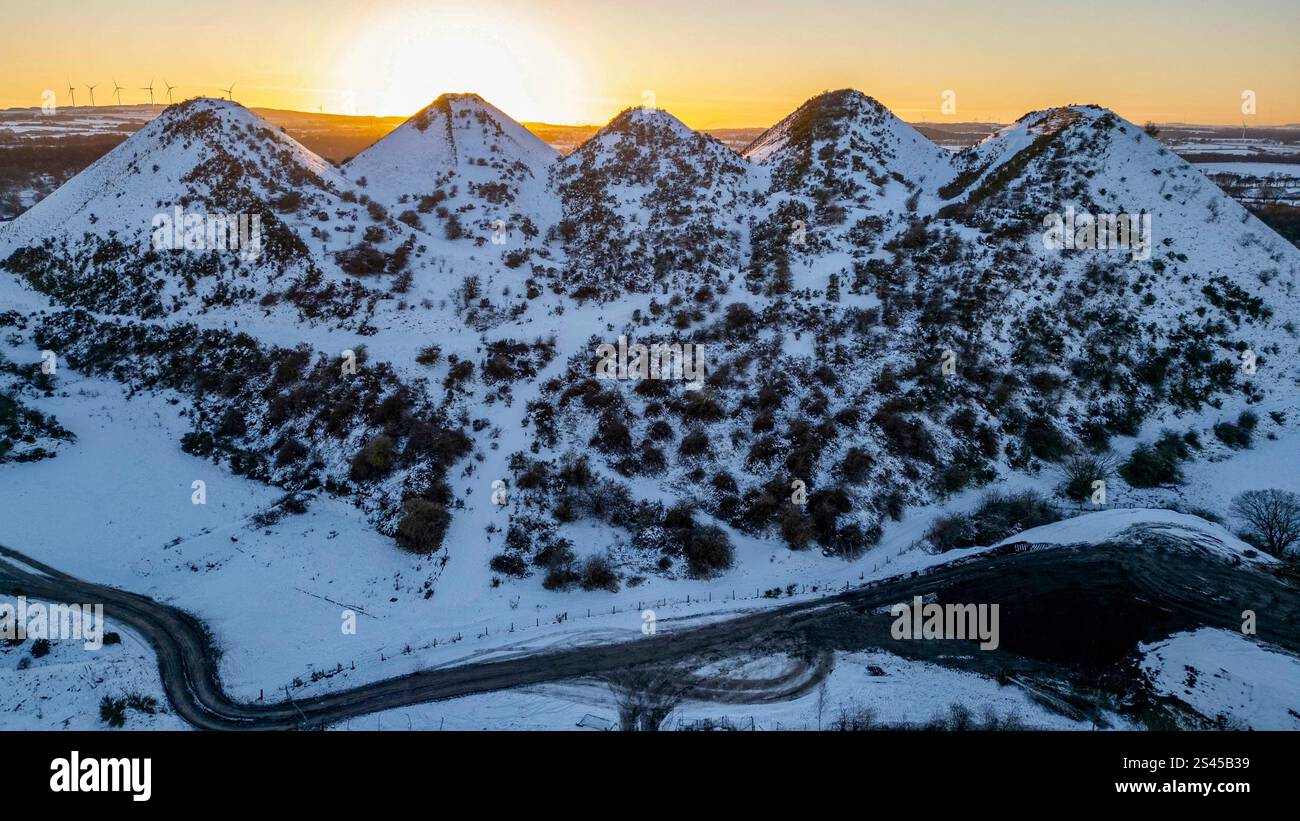 Aerial view of the Five Sisters shale bing after snowfall, West Calder ...
