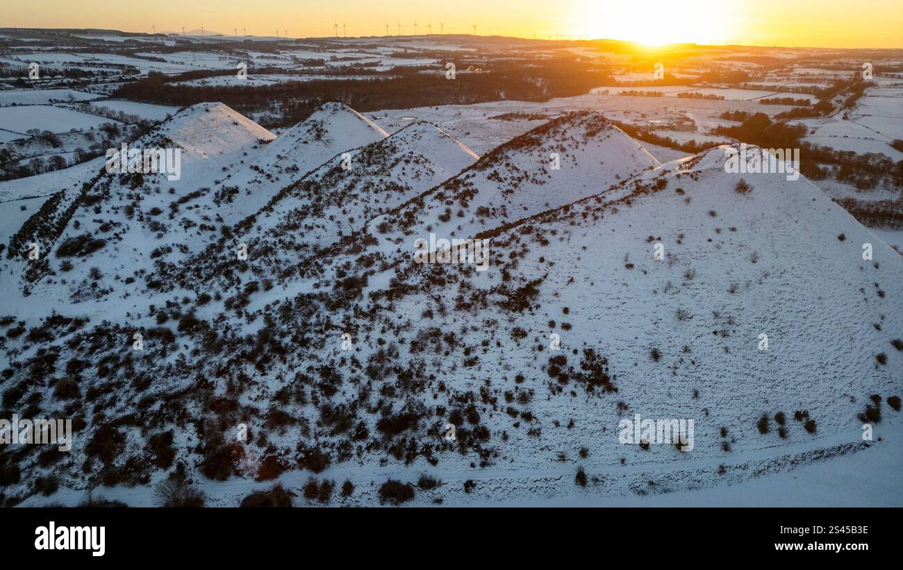 Aerial view of the Five Sisters shale bing after snowfall, West Calder ...