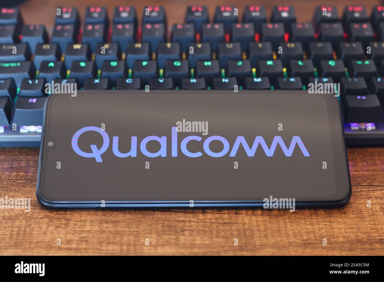 In this photo illustration, the Qualcomm logo is seen displayed on a ...
