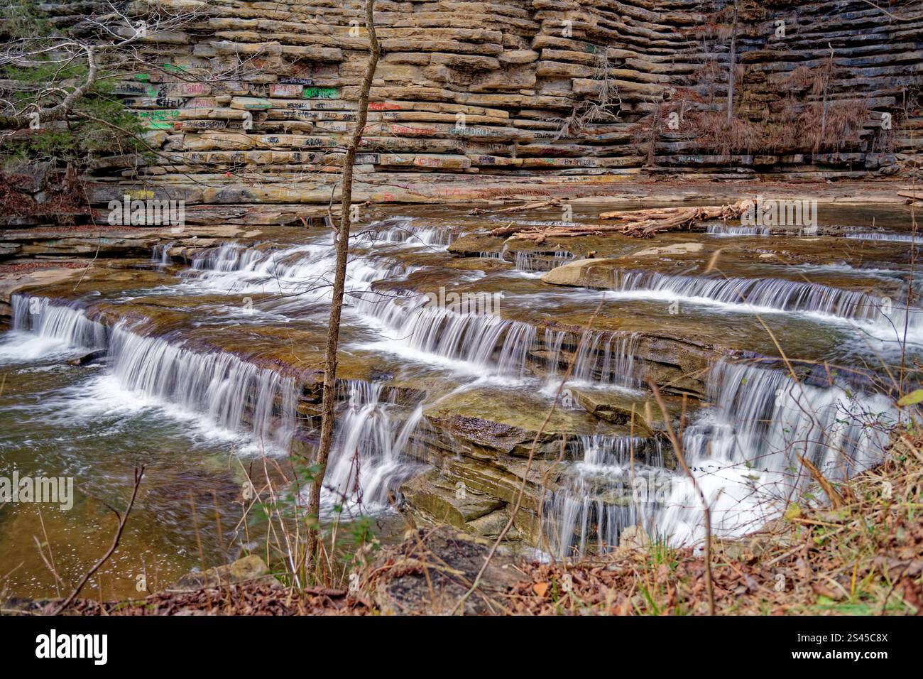 Lots of Graffiti covering a rock bluff destruction to a beautiful ...
