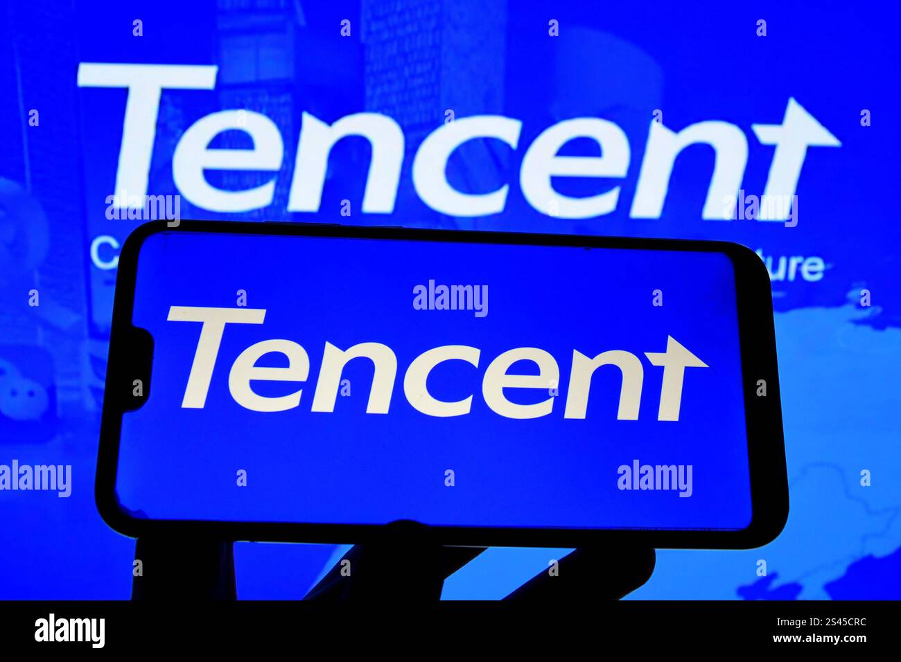 In this photo illustration, a Tencent company logo is displayed on a ...
