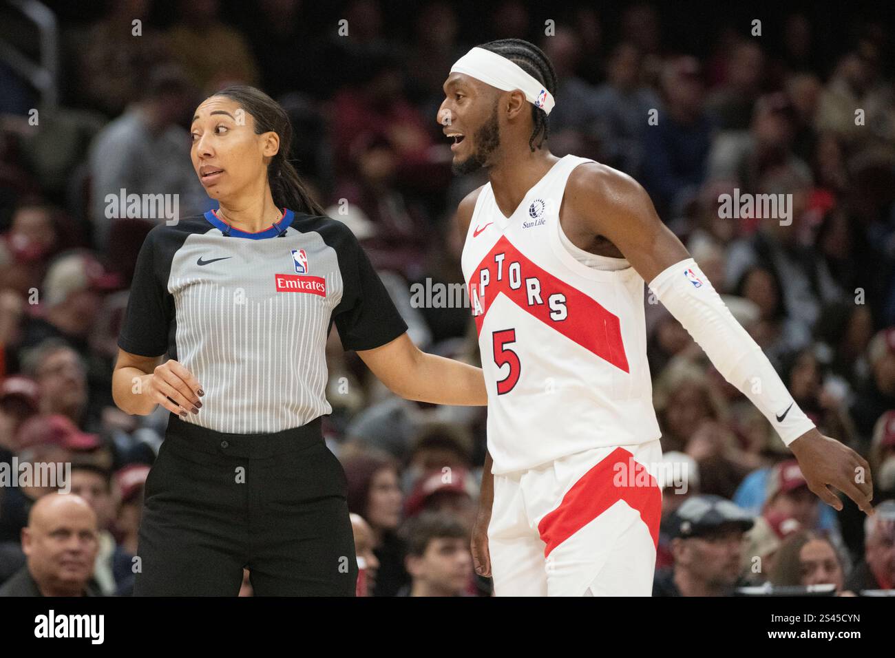 Toronto Raptors' Immanuel Quickley (5) talks with referee Simone Jelks ...