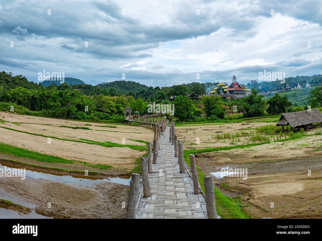 Aerial view Amazing beauty in the hill tribe village.The bridge snaking ...