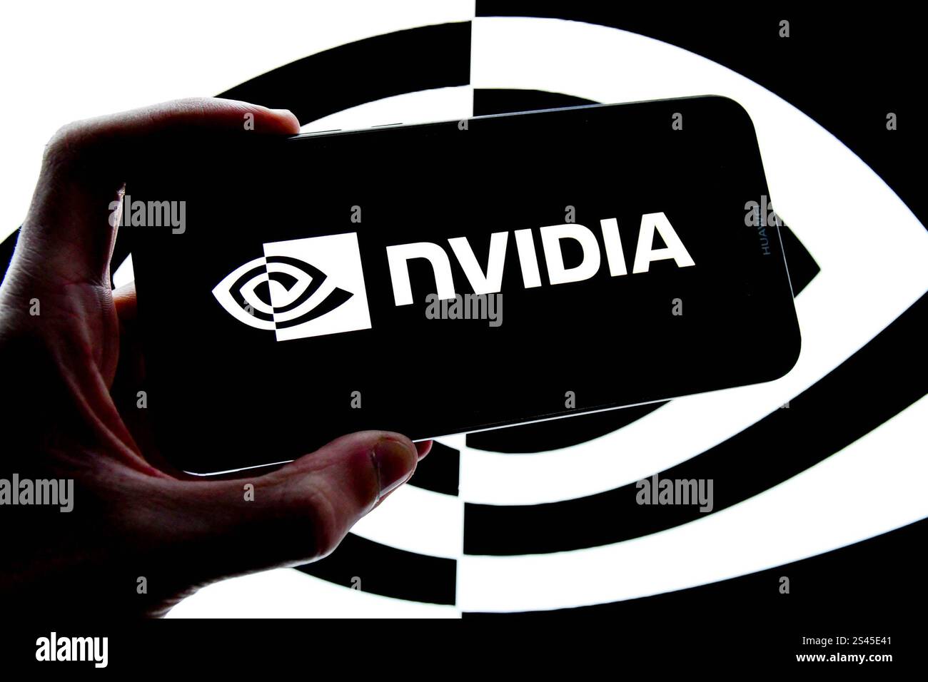 In this photo illustration, the Nvidia company logo is seen displayed ...