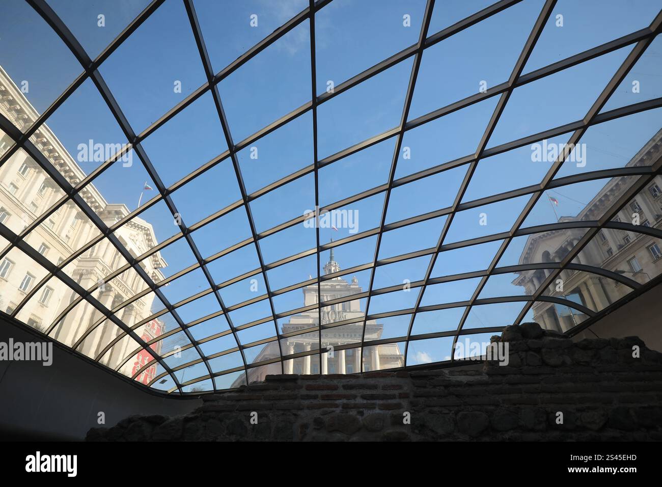 Workers wash and clean the glass dome of the ancient cultural and ...