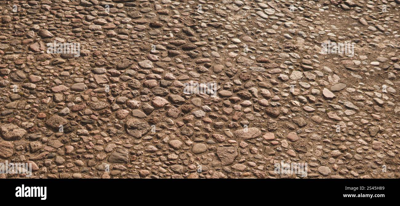 structure of the old cobblestone in the courtyard of the medieval ...