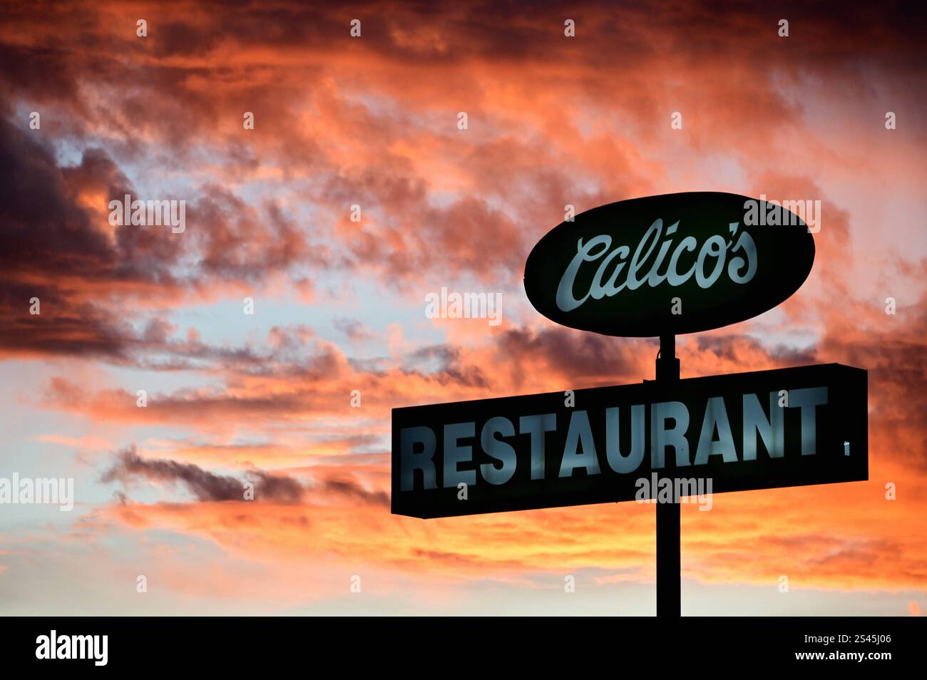 Restaurant sign in front of a dramatic evening sky, Kingman, Arizona ...