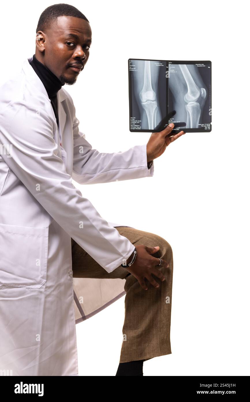 Orthopedic doctor examines x-ray of knee joint, showcasing medical ...