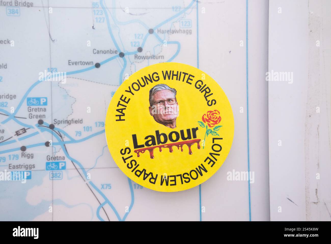 In a bus shelter in Dumfries town centre, Scotland, a political sticker ...