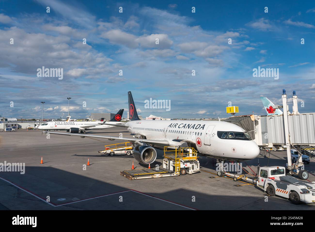 An Air Canada airplane serviced at the gate in Montreal, Quebec, Canada ...